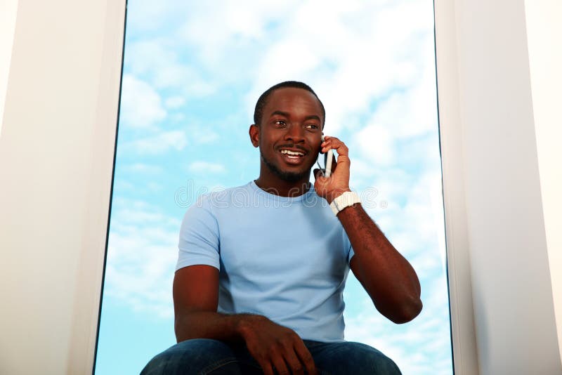 African Man Talking on the Phone Stock Image - Image of discussing ...