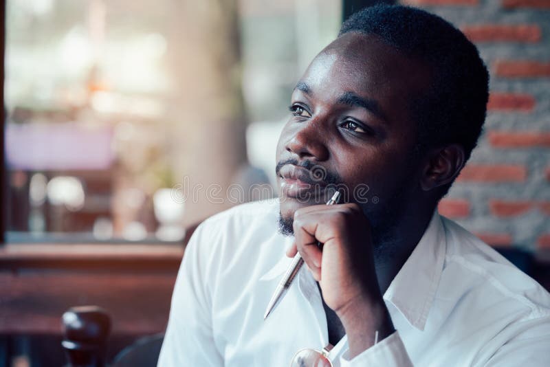 African Man Thinking and Looking with Holding a Pan Stock Photo - Image ...