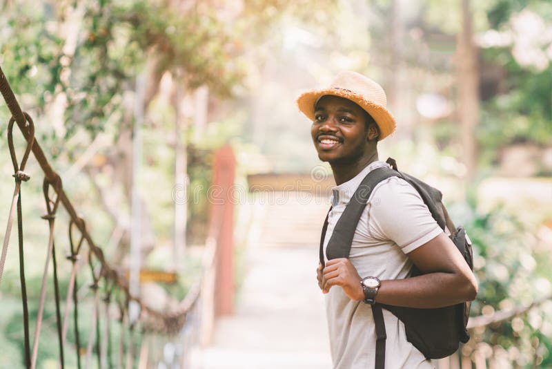 African Man Traveler Standing on the Bridge with Smile and Happy Stock ...
