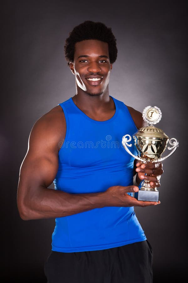 African Man with Trophy stock image. Image of isolated - 35313369