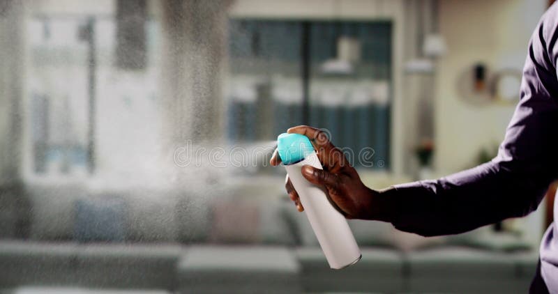 African Man Using Air Spray Stock Image - Image of black, carpet: 305228995