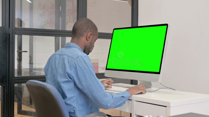African Man Using Computer with Green Screen Stock Video - Video of ...