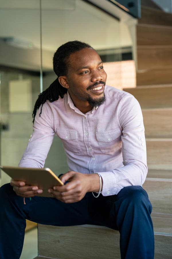 African Man Using Digital Device, Tablet for Online Communication ...