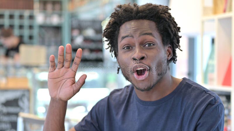 African Man Waving at the Camera Stock Image - Image of cafe, meeting ...