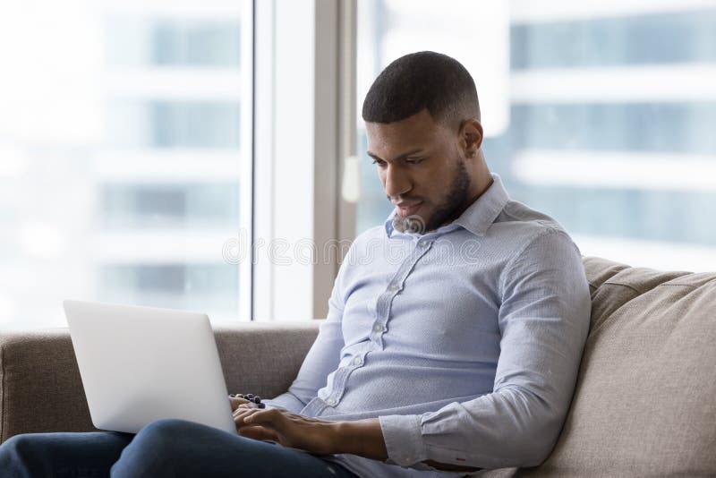 African Man Working or Studying Using Laptop Stock Photo - Image of ...
