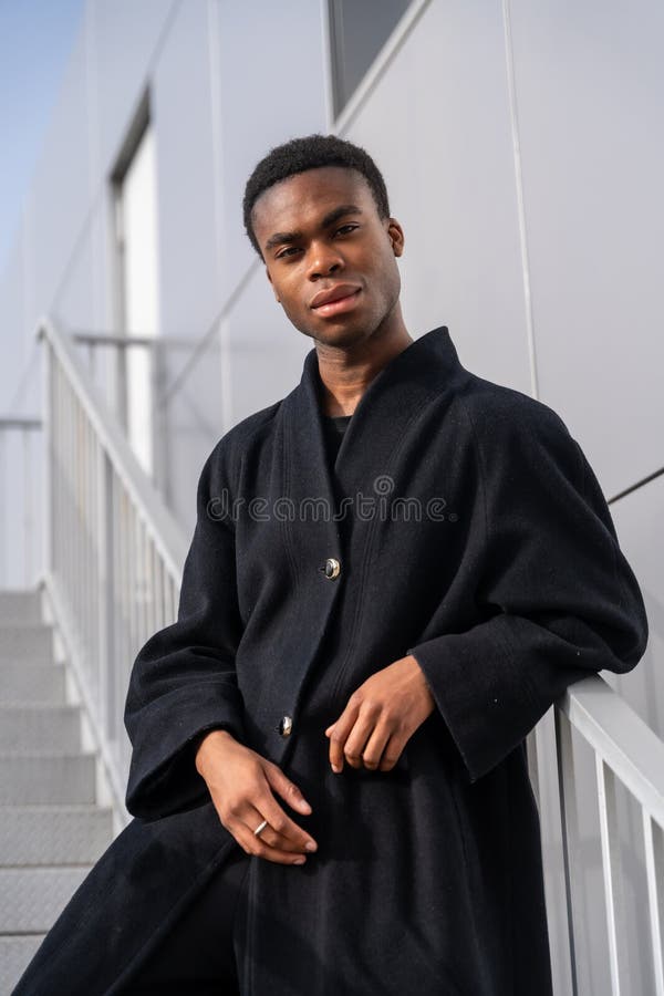 African Model Posing with Black Clothes Railing on Stairs Stock Image ...
