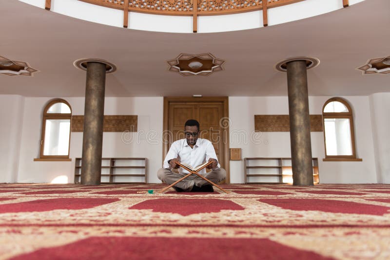 African Muslim Man is Reading the Koran Stock Image - Image of arab ...