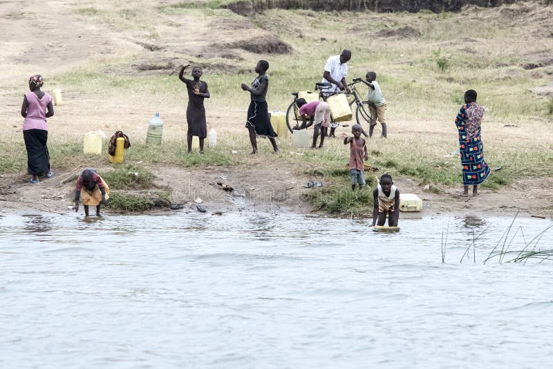 African People Getting Water from River for Home, Uganda Editorial ...