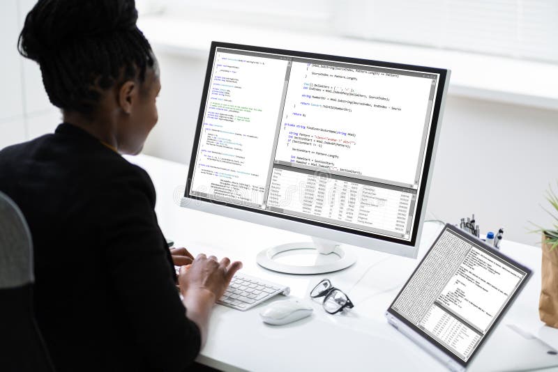 African Programmer or Coder Using Multiple Monitors Stock Photo - Image ...