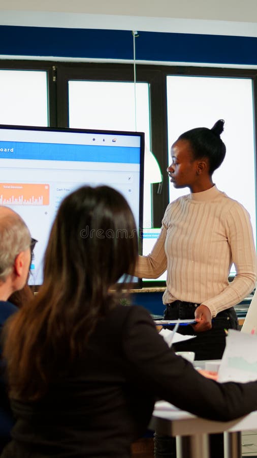 African Project Manager Holding Financial Meeting Showing Statistical ...