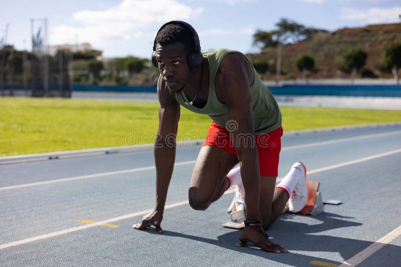 African Runner in Starting Position on Athletics Track Stock Photo ...