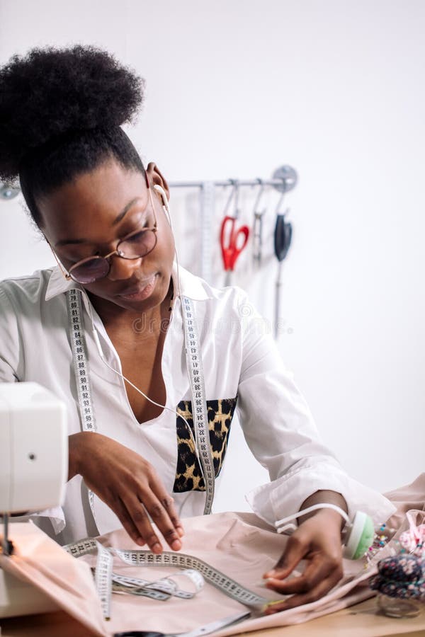 African Seamstress Working with Fabric Takes Measures Stock Photo ...