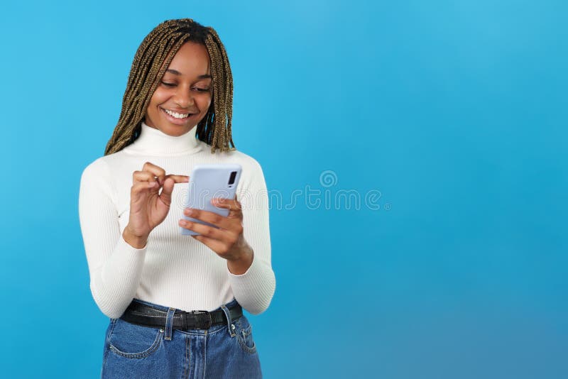African Smiling Woman Using the Mobile Phone Stock Photo - Image of ...