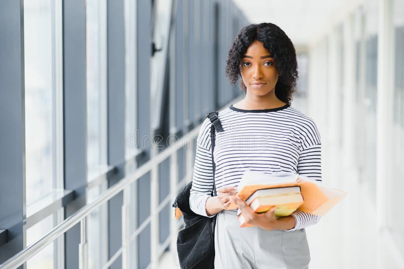 African Student Girl in University Corridor. Obtaining Professional ...