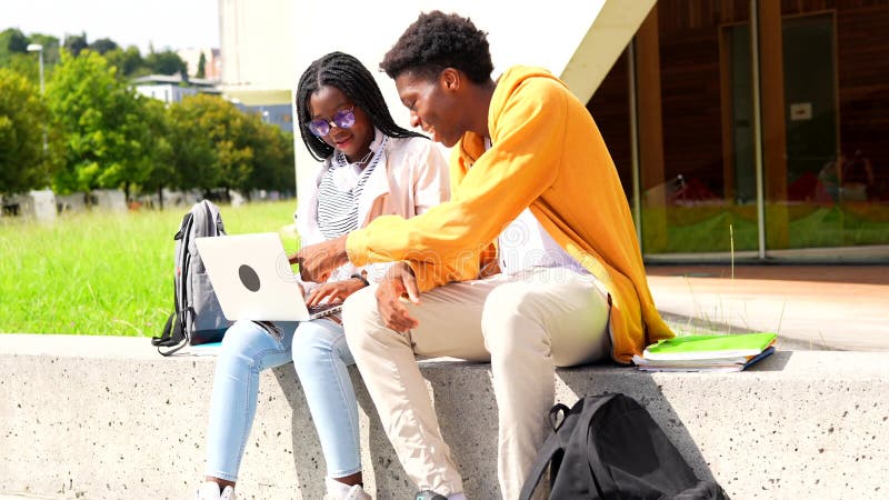 African Students Using Laptop Sitting in the Campus Together Stock ...