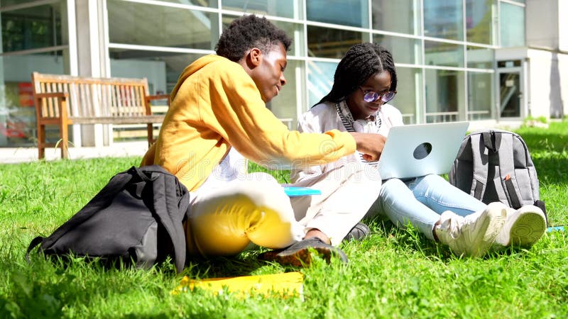 African Colleagues Studying Together Using Laptop in the Campus Stock ...