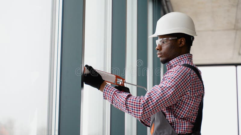 African Windows Installation Worker Use of Silicone Foam when ...