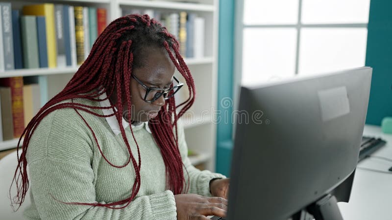 African Woman with Braided Hair Student Using Computer at University ...