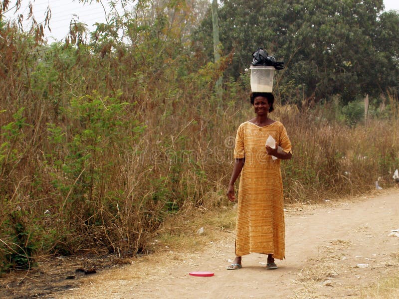 African Woman with Bucket on the Head Editorial Stock Photo - Image of ...