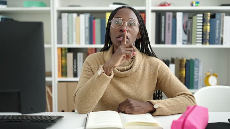 African Woman Reading a Book Asking for Silence at Library University ...