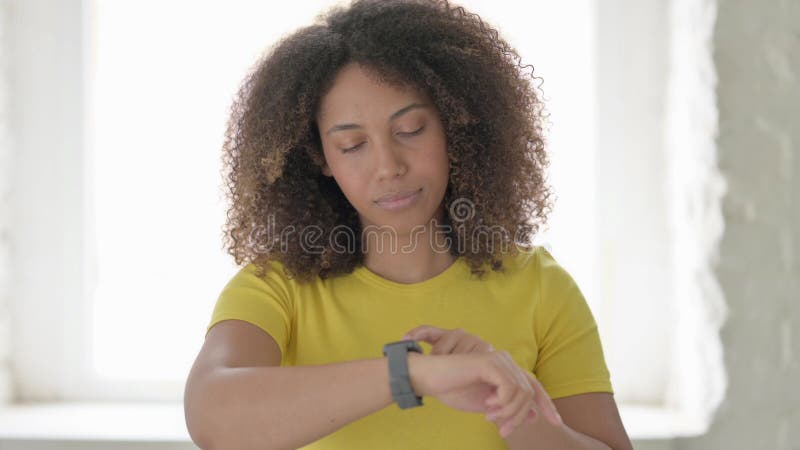 African Woman Using Smart Watch Stock Image - Image of application ...