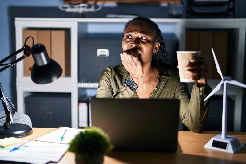 African Woman Working Using Computer Laptop at Night Looking Stressed ...