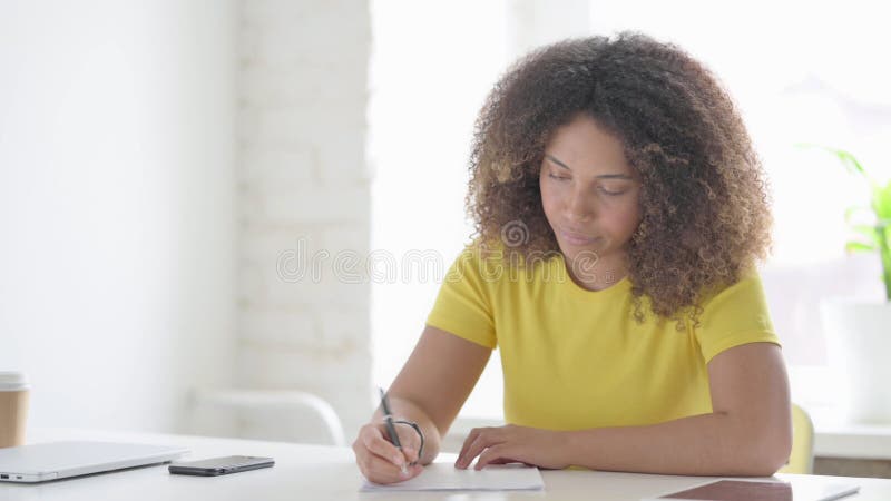 African Woman Writing on Paper in Office Stock Photo - Image of ...