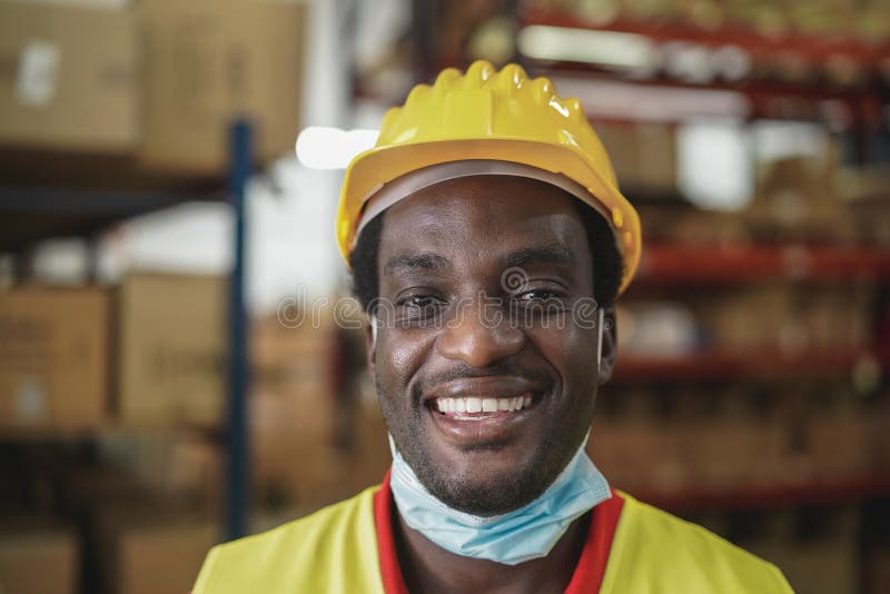 African Worker Man Smiling on Camera Inside Warehouse during ...