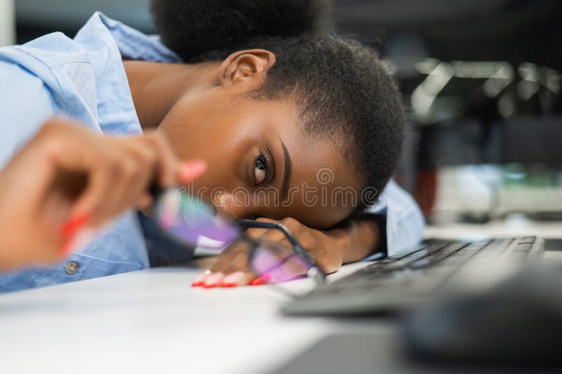 African Young Woman Sleeping at Work Desk. Stock Image - Image of ...