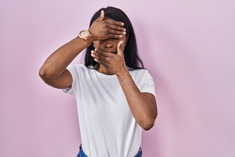 African Young Woman Wearing Casual White T Shirt Covering Eyes And