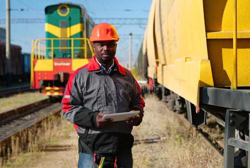 Afro-american Railway Man with Tablet Computer at Freight Train ...