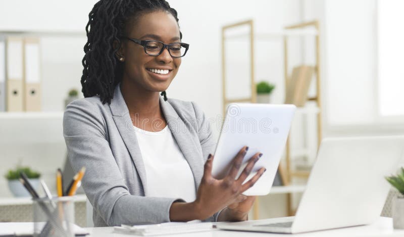 Afro Business Lady Using Digital Tablet and Laptop in Office Stock ...