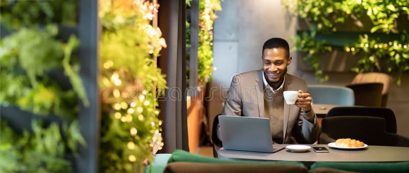 Afro Guy Drinking Tea and Using Computer Stock Photo - Image of ...