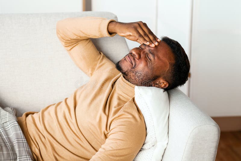 Guy Having Headache Touching Forehead Lying on Sofa at Home Stock Image ...