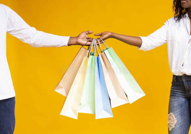 Afro Man And Woman Holding Lots Of Shopping Bags Closeup Stock Image