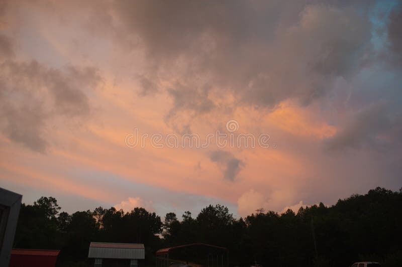 The Afterglow of a Late Sunset Stock Photo - Image of tree, cumulus ...