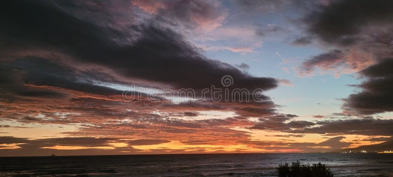 Afterglow Sky Dramatic Display Stock Photo - Image of shore, sunrise ...