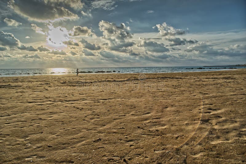 Afternoon on the beach stock image. Image of sunset - 180649427