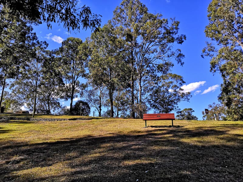 An Afternoon Park Bench in the Sun Stock Image - Image of clouds ...