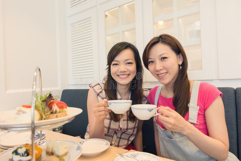 Young People Eating Sushi in Restaurant Stock Photo - Image of eating ...