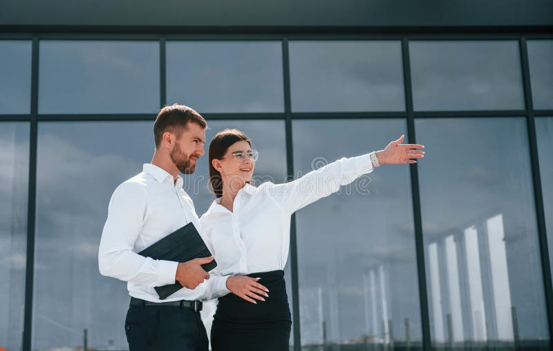 Against Big Windows. Man with Woman are Working on the Construction ...