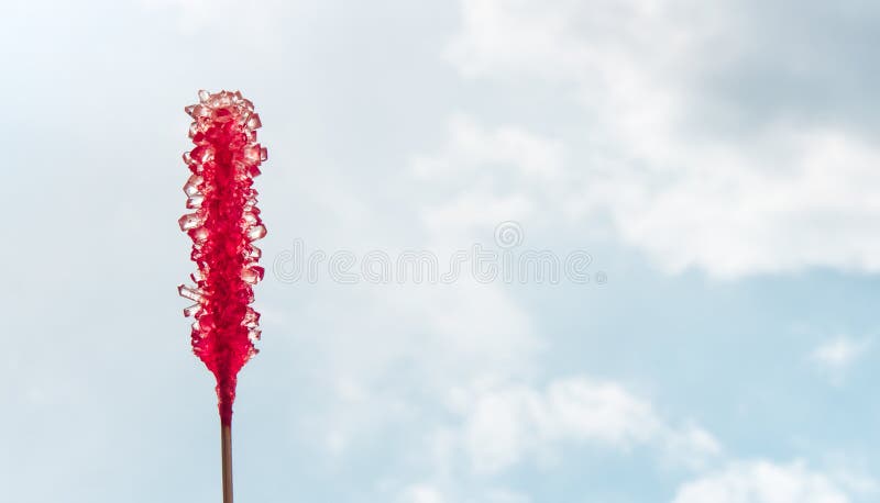 Against the Blue Sky One Bright Red Sugar Crystal on a Stick Stock ...