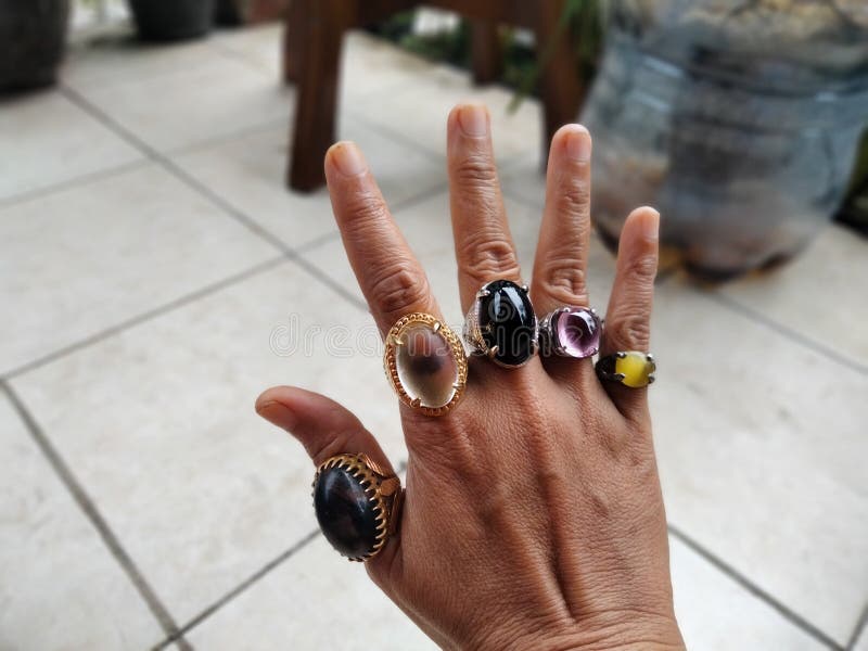 Agate Ring on the Finger of Five Beautiful Hands Stock Image - Image of ...