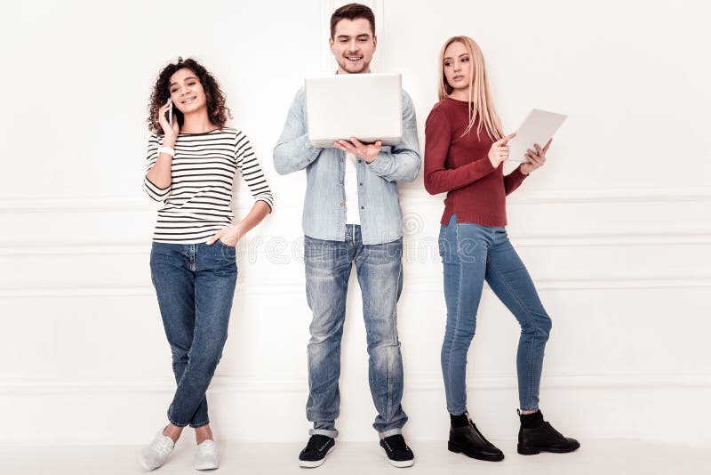 Nice Young People Using Their Gadgets Stock Photo - Image of ...