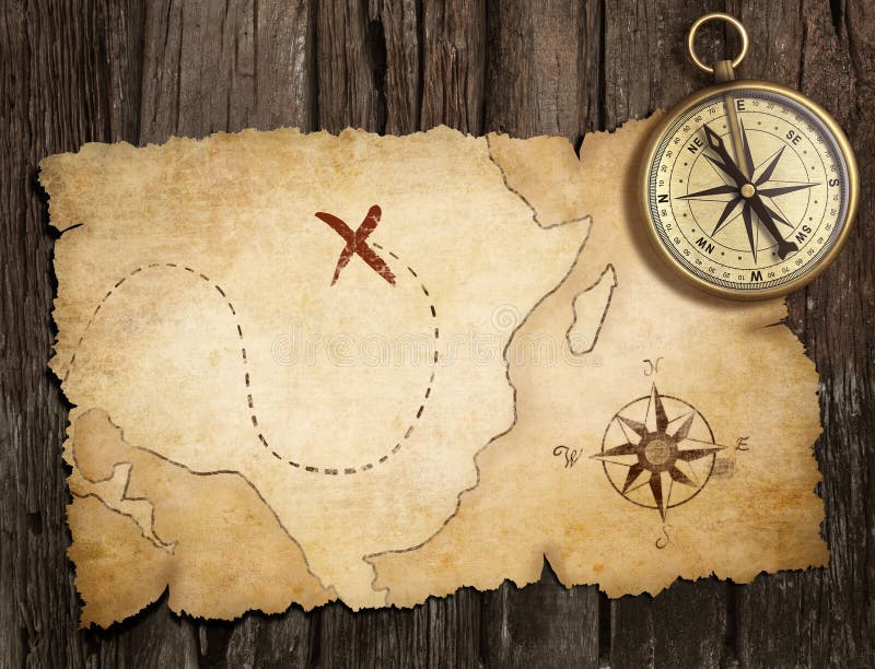 Aged Brass Antique Nautical Compass on Table with Old Treasure M Stock ...