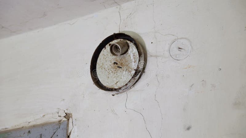 Aged Ceiling with Cobwebs, Cracks and a Metal Light Fixture Attached ...