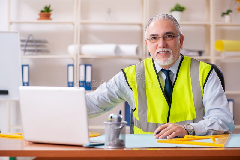 The Aged Construction Engineer Working in the Office Stock Image ...
