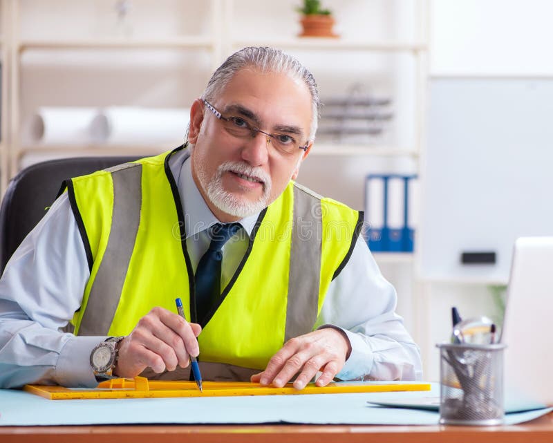 Aged Construction Engineer Working in the Office Stock Image - Image of ...