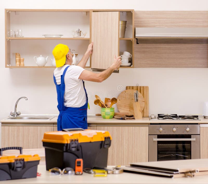 Aged Contractor Repairman Working in the Kitchen Stock Photo - Image of ...