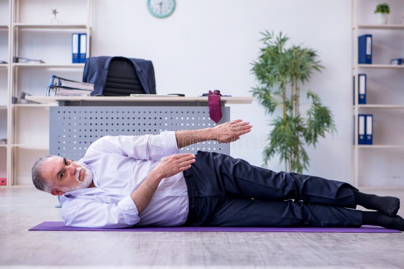 Aged Male Employee Doing Physical Exercises during Break Stock Image ...